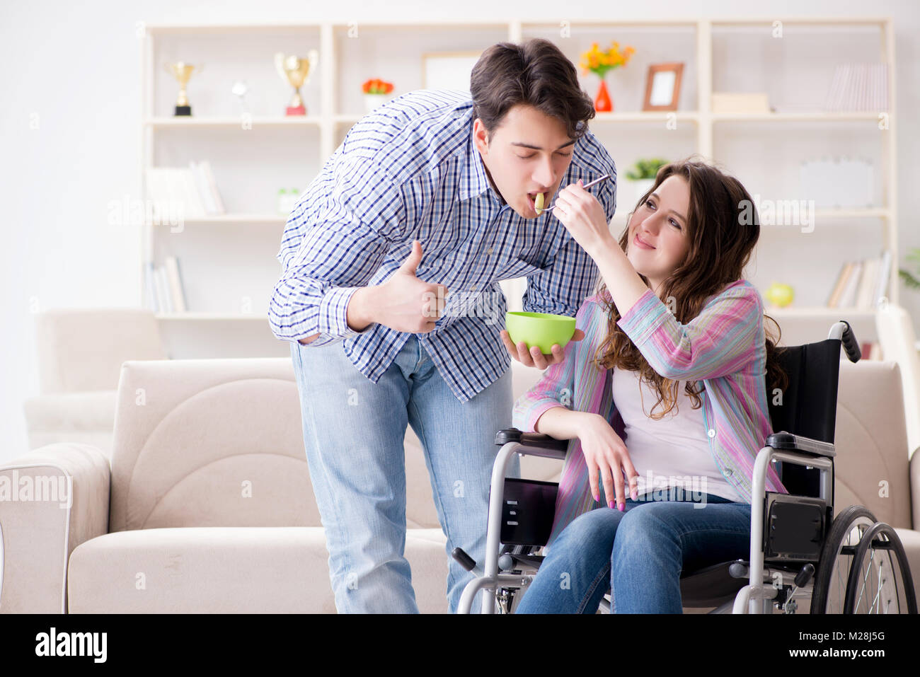 Young family taking care of each other Stock Photo - Alamy