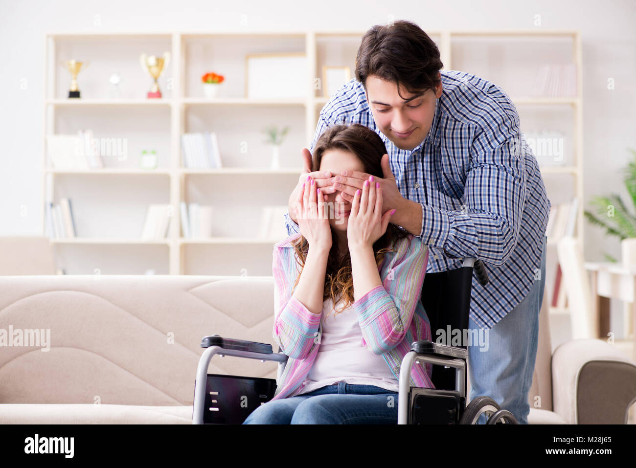 Young family taking care of each other Stock Photo - Alamy