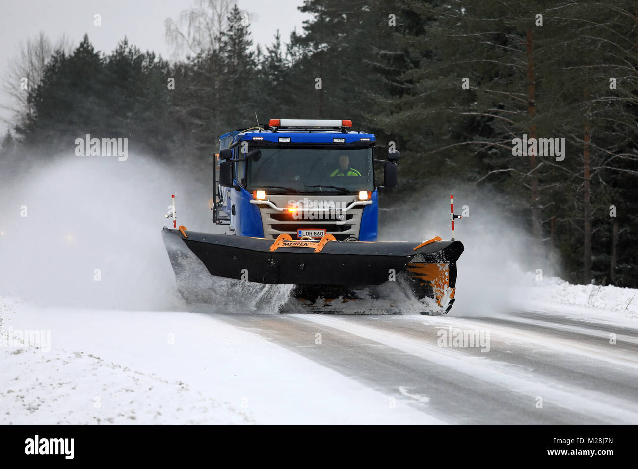 SALO, FINLAND - FEBRUARY 3, 2018: Scania truck equipped with snowplow ...
