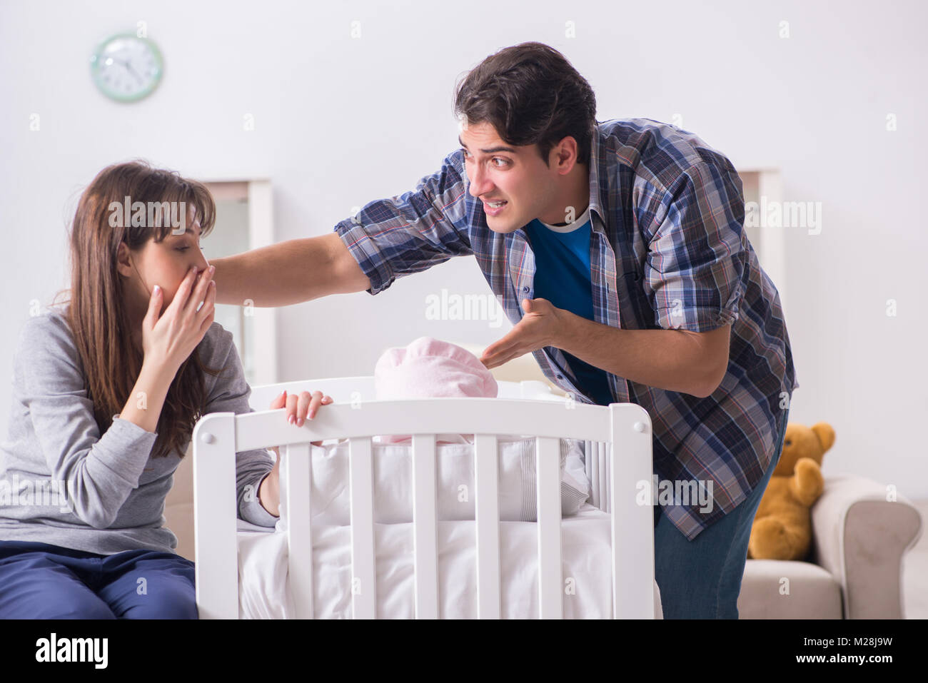 Young dad cannot stand baby crying Stock Photo - Alamy