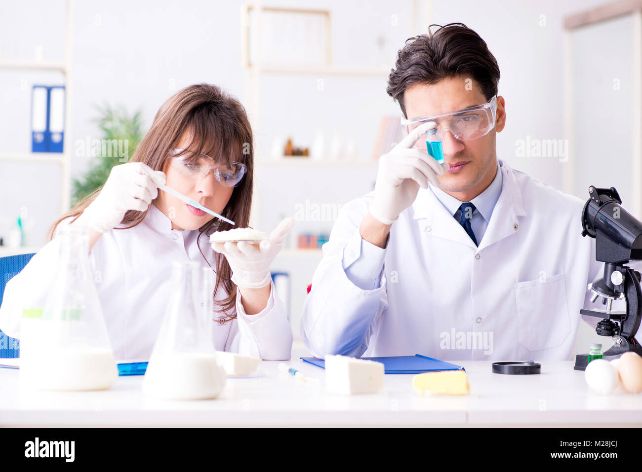 Two lab doctor testing food products Stock Photo - Alamy