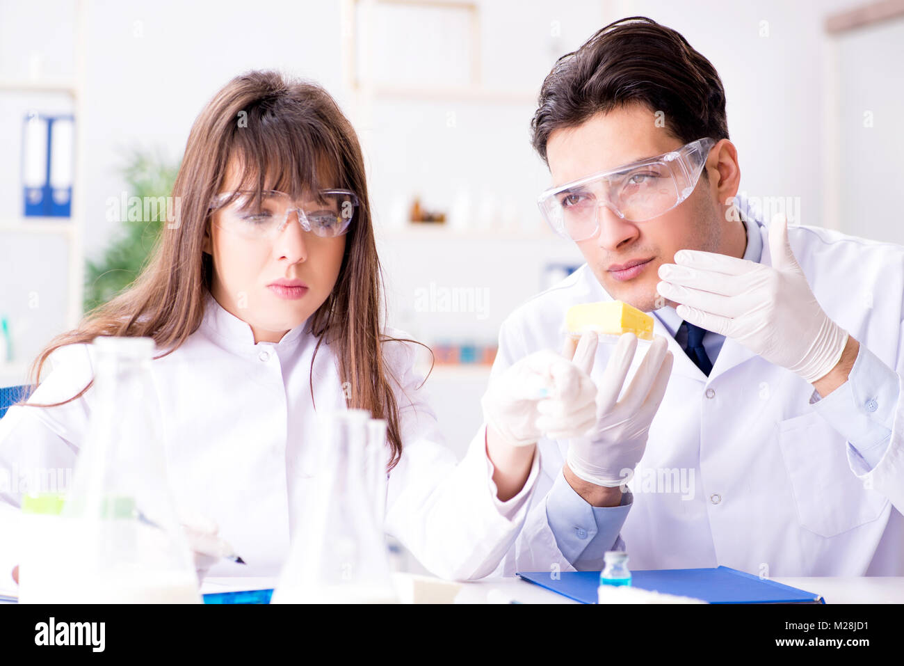 Two lab doctor testing food products Stock Photo - Alamy