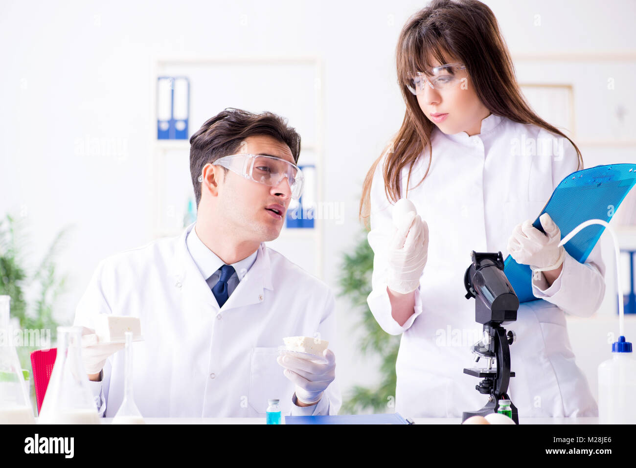Two lab doctor testing food products Stock Photo - Alamy