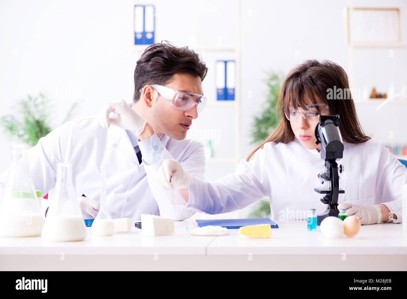 Two lab doctor testing food products Stock Photo - Alamy