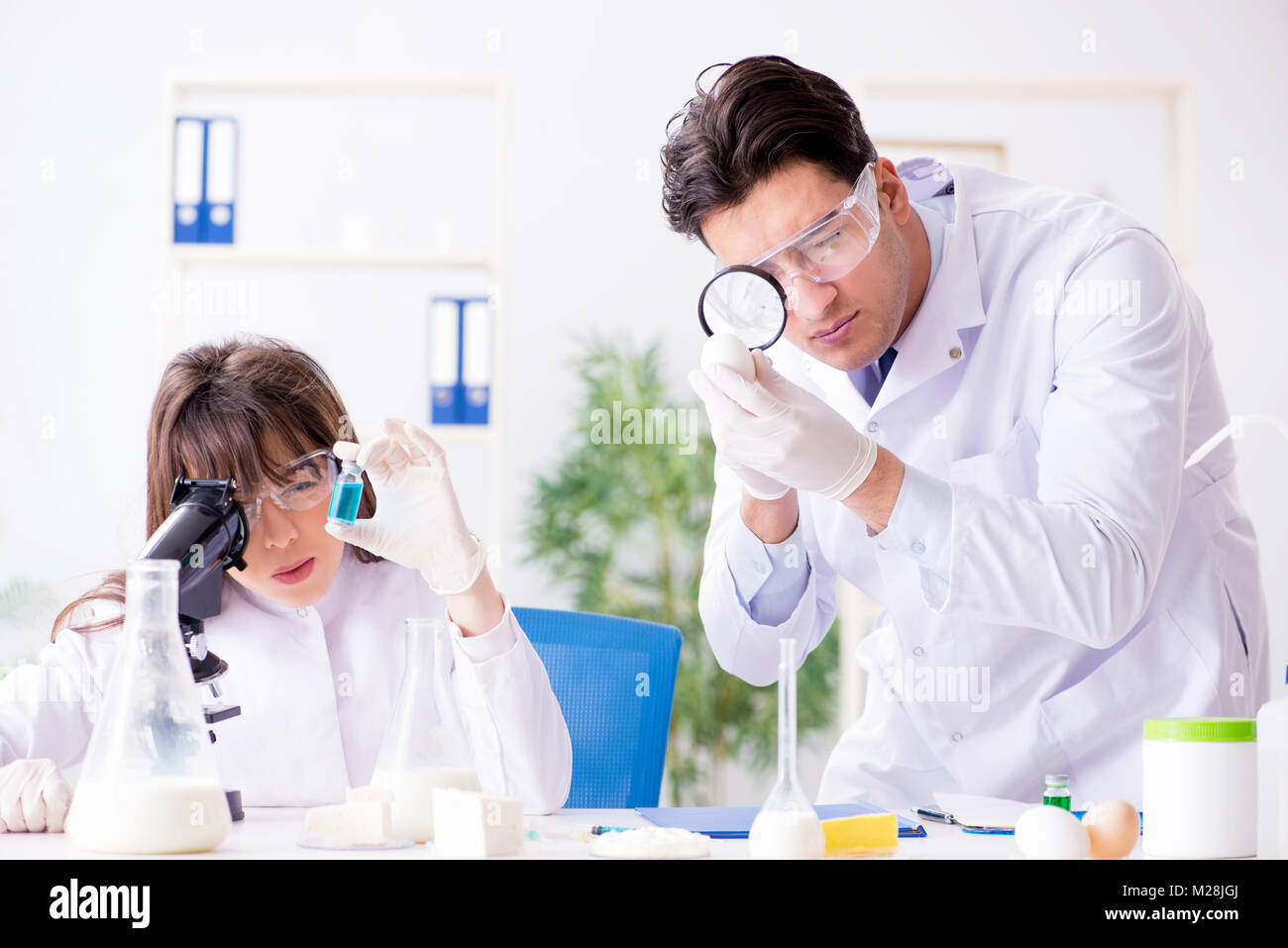Two lab doctor testing food products Stock Photo - Alamy