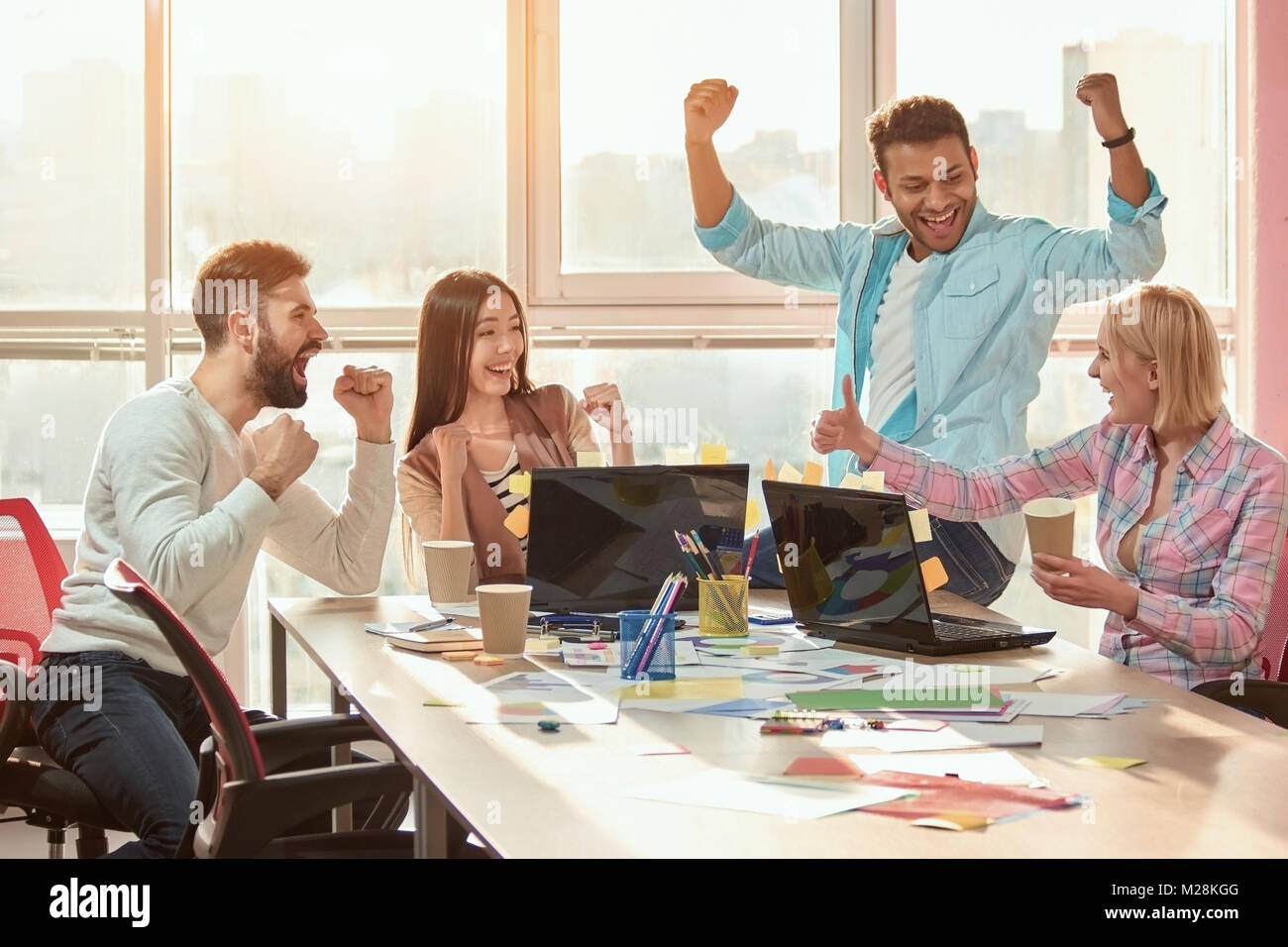 Group of winners celebrate victory or great success. Positive multi ...