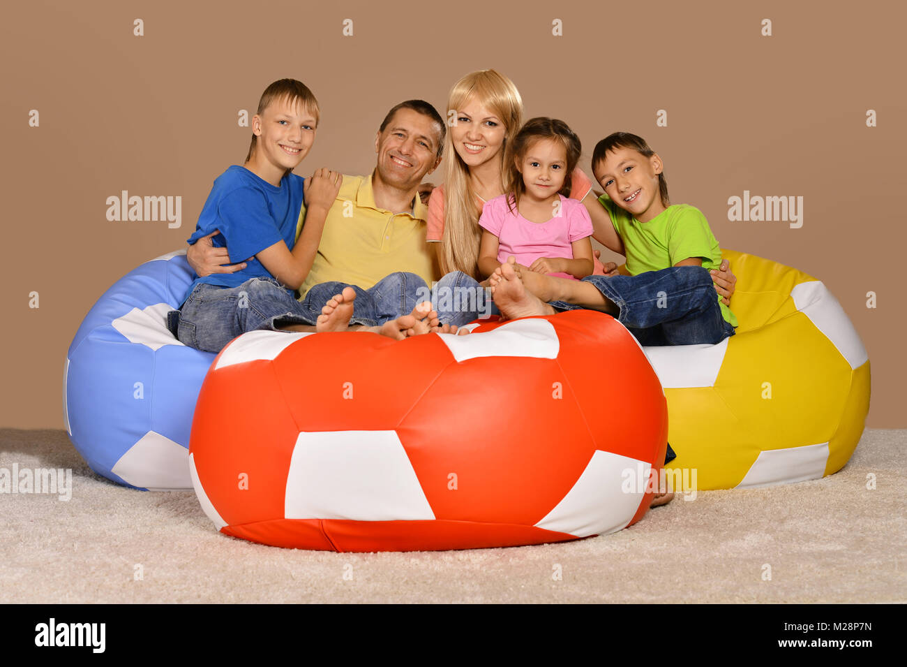 Happy family of five having fun in a room Stock Photo - Alamy