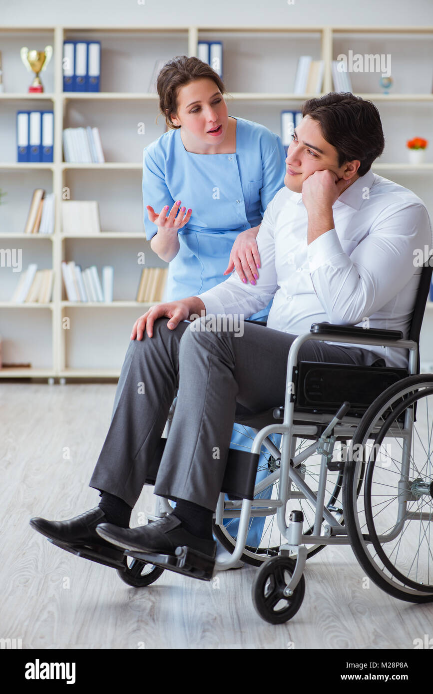 Disabled patient on wheelchair visiting doctor for regular check up ...