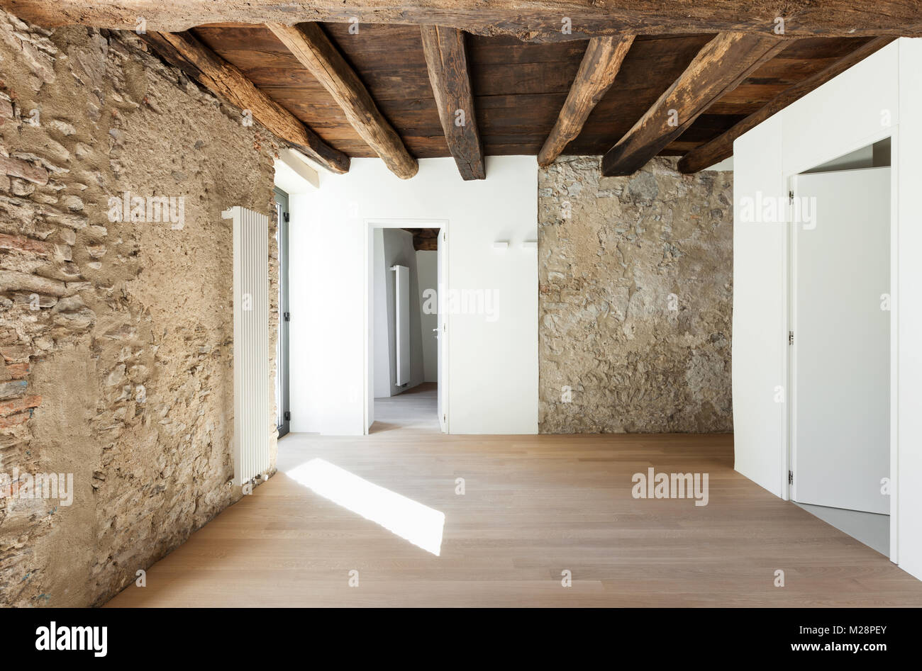 beautiful modern loft, empty room with stone walls Stock Photo - Alamy