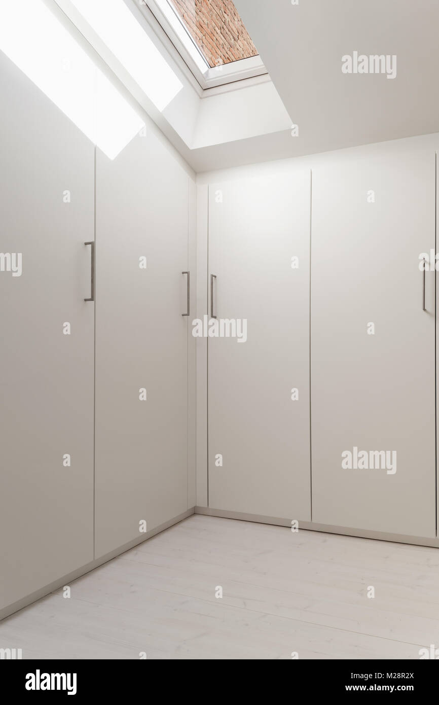 interior house, loft, empty room with wardrobes wall Stock Photo - Alamy