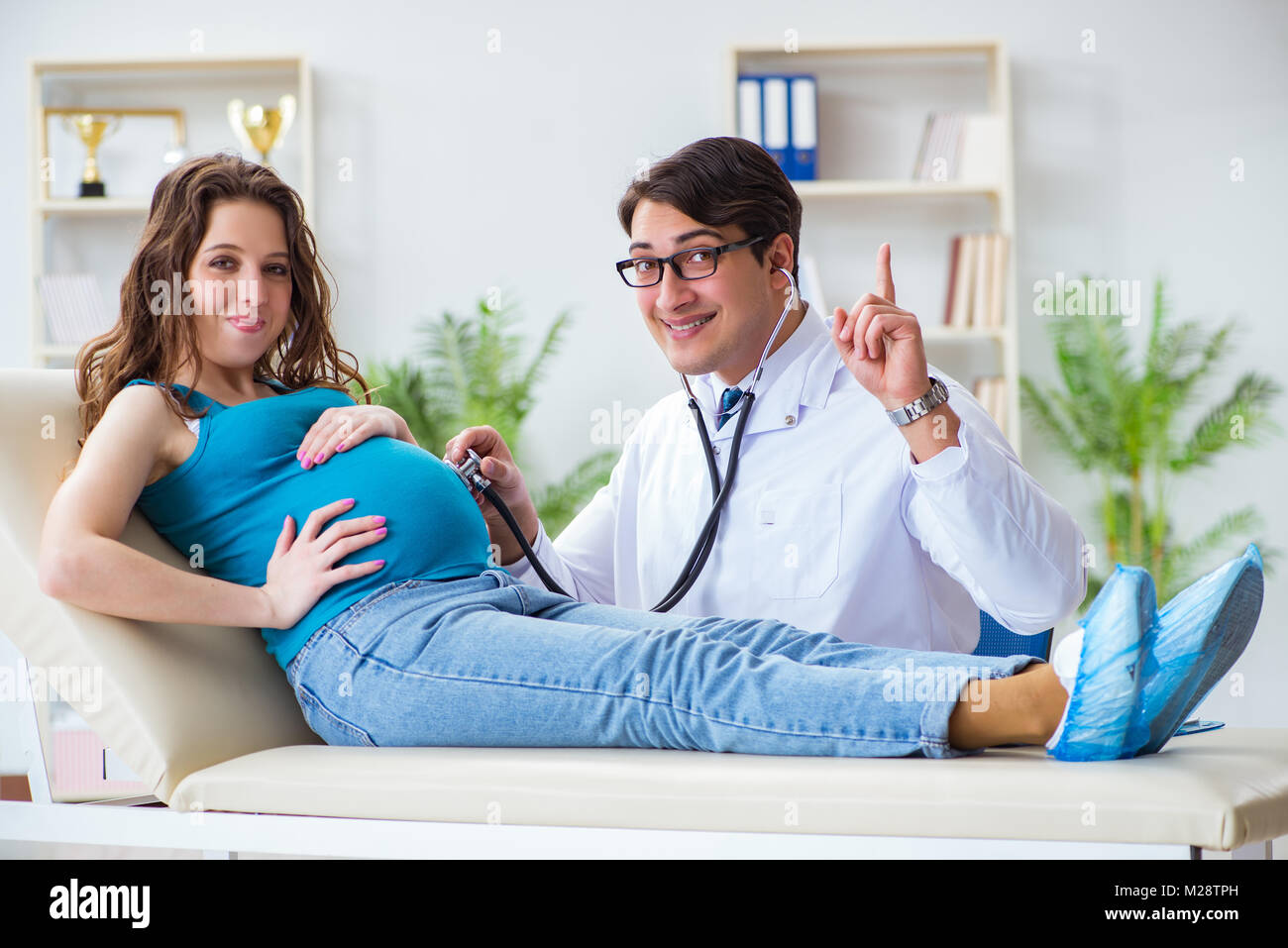 Doctor examining pregnant female patient in hospital Stock Photo - Alamy