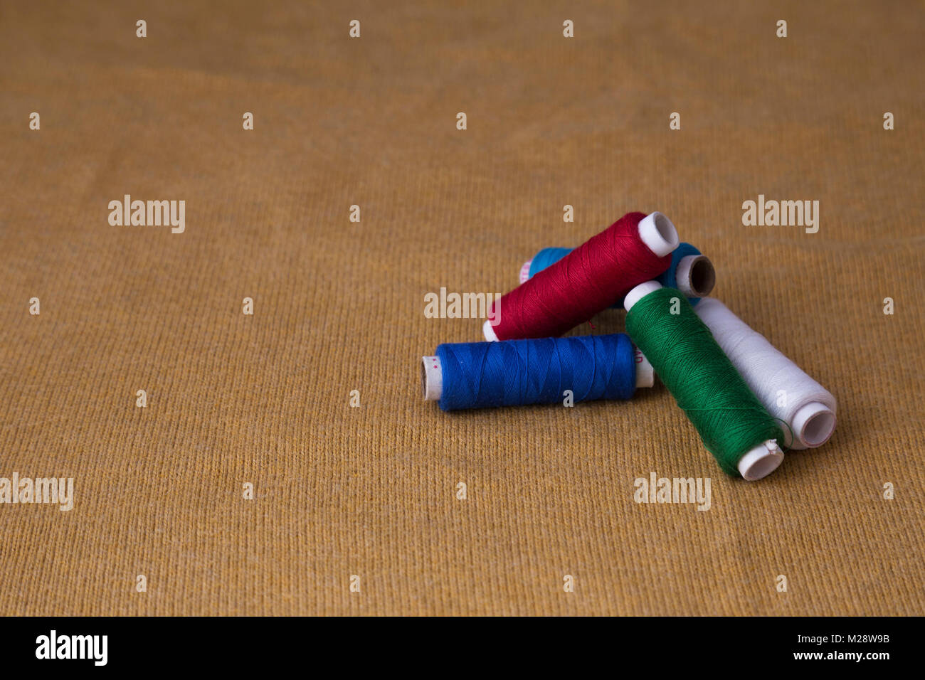 Pile of sewing thread spools hi-res stock photography and images - Alamy
