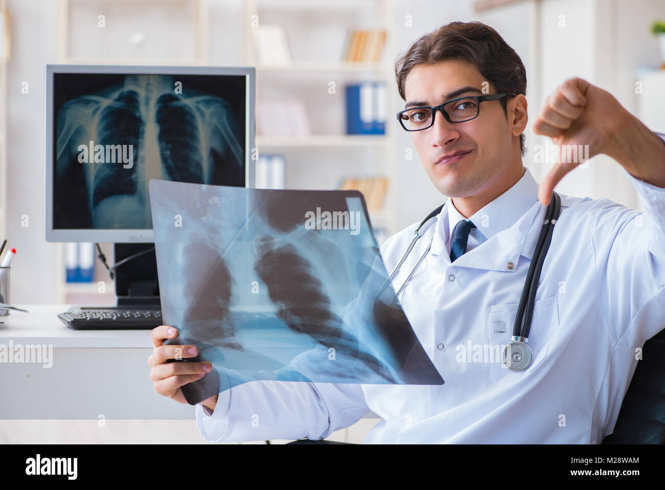Doctor radiologist looking at x-ray images Stock Photo - Alamy