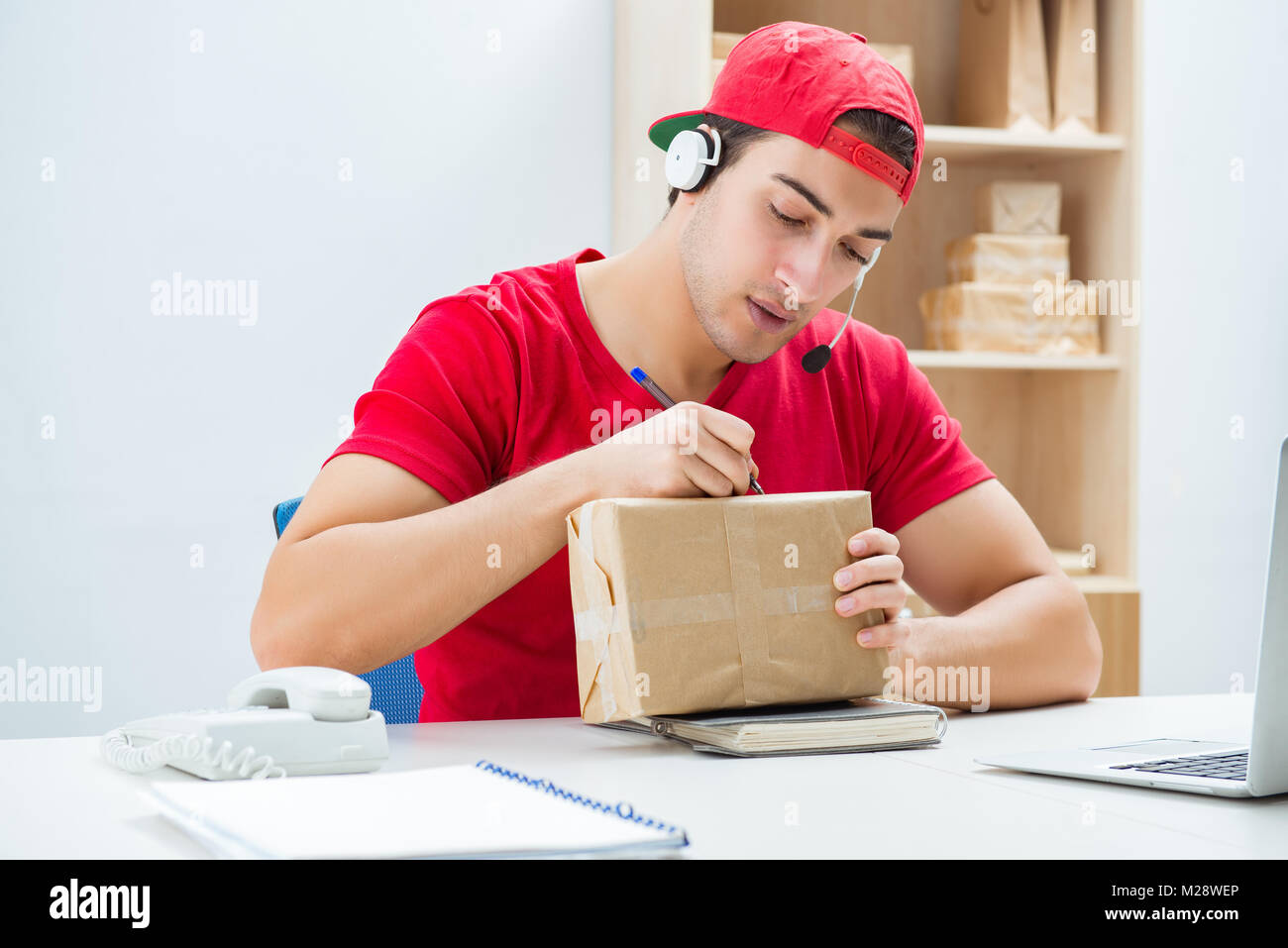 Call center worker at parcel distribution center in post office Stock ...