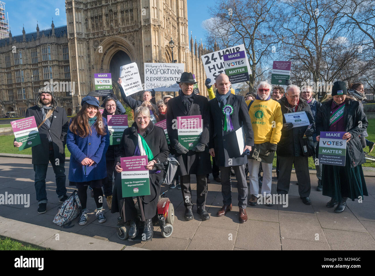 London, UK. 5 February 2018. Campaigners pose in Parliament Square as ...