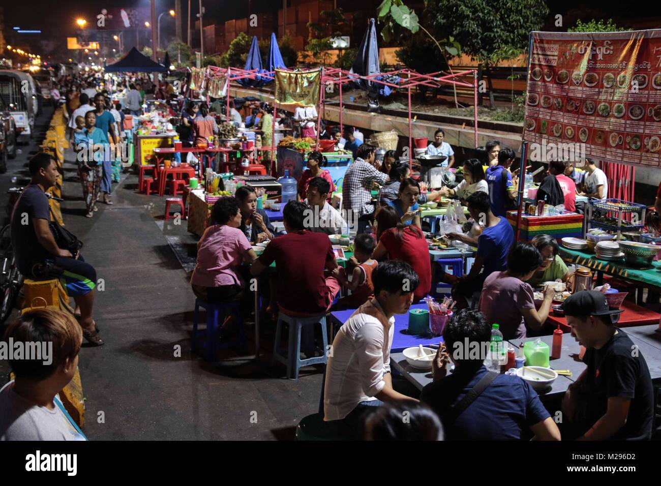 Yangon, Myanmar. 12th Mar, 2017. Local seen having dinner at a night ...