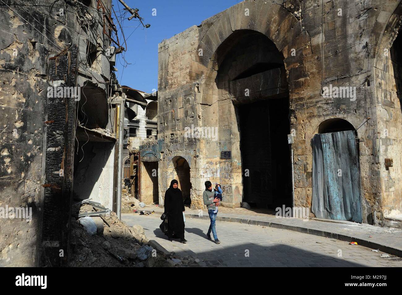 Aleppo, Syria. 6th Feb, 2018. People walk past Bab al-Nasr Gate in the ...