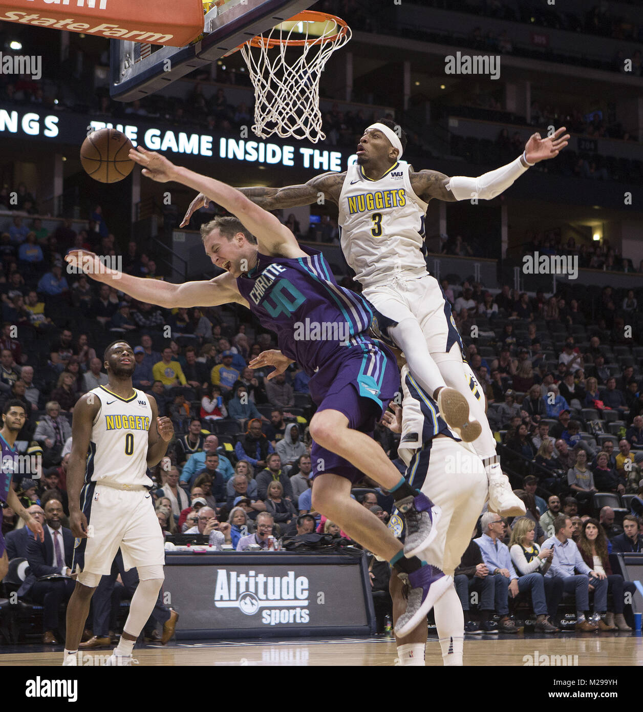 Denver, Colorado, USA. 5th Feb, 2018. Hornets CODY ZELLER, left, gets ...