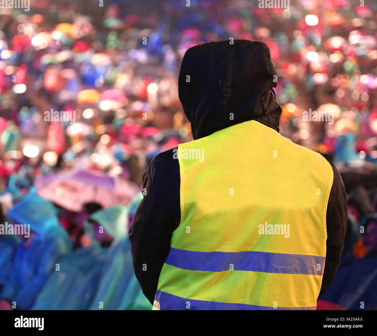 security guard controls people during an important event during a ...