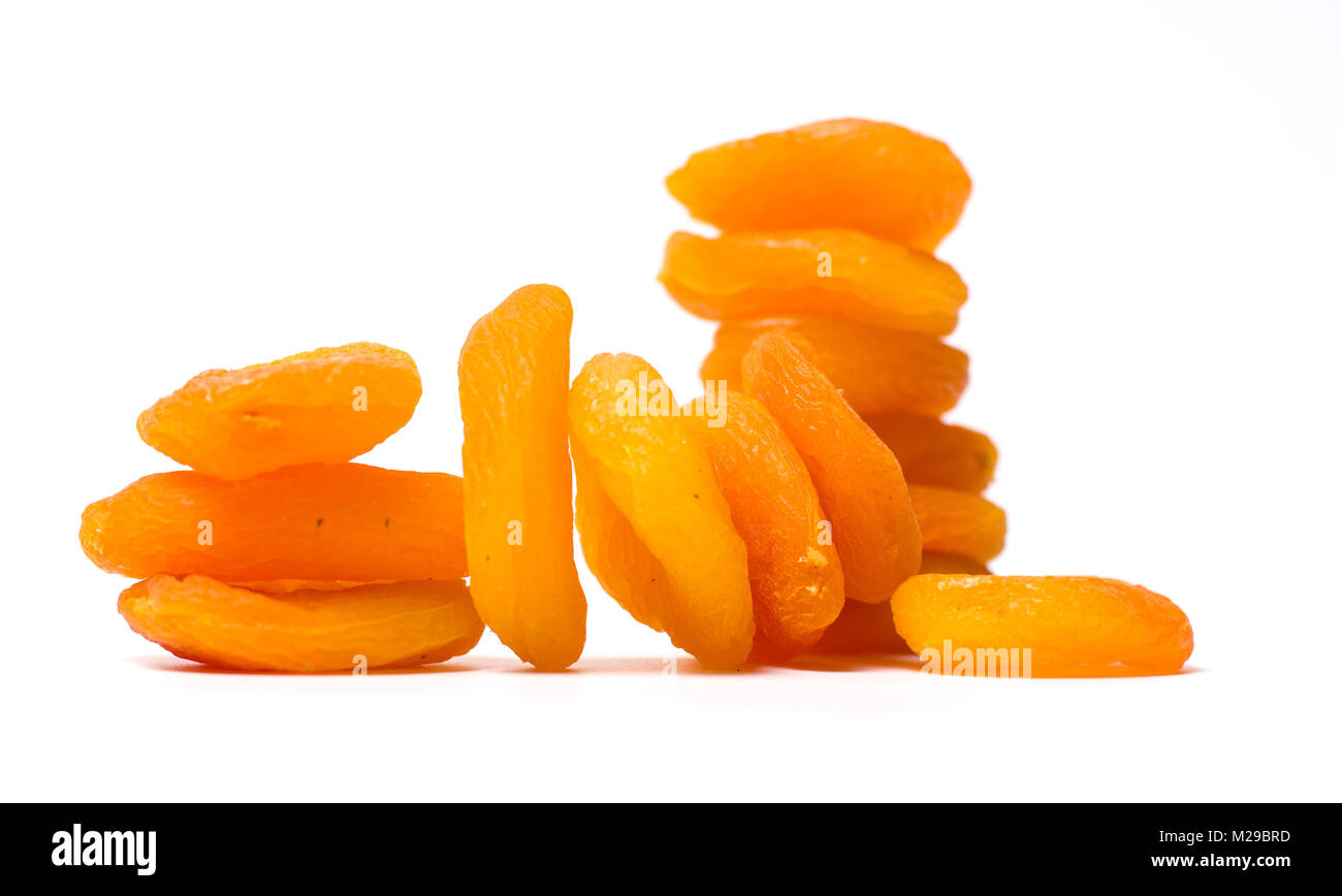 Dried apricot slices on a pile isolated on white background Stock Photo ...