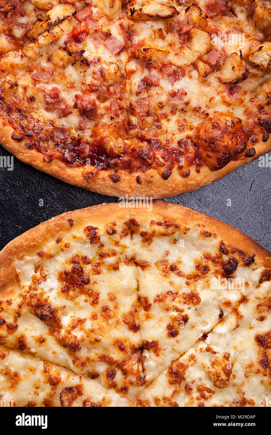 Top view of two pizza lying next to each other Stock Photo - Alamy