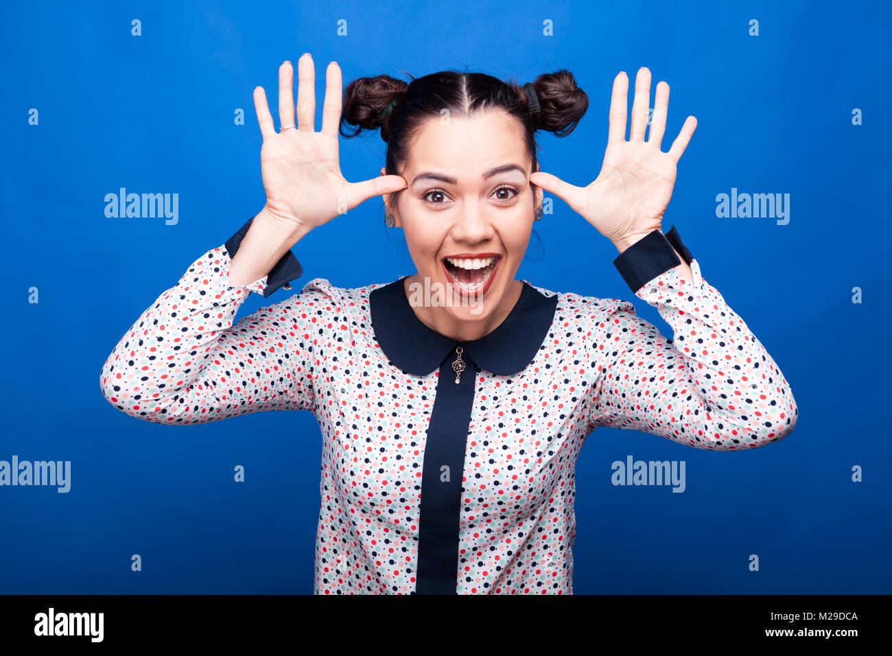 Happy woman making silly faces to the camera Stock Photo - Alamy