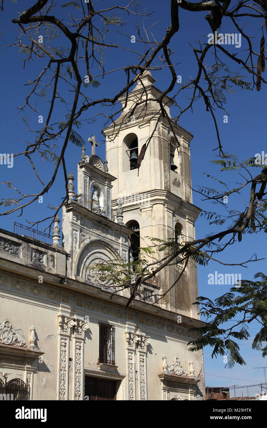 Sancti Spiritus, Cuba - old religious architecture. Church and a tree ...