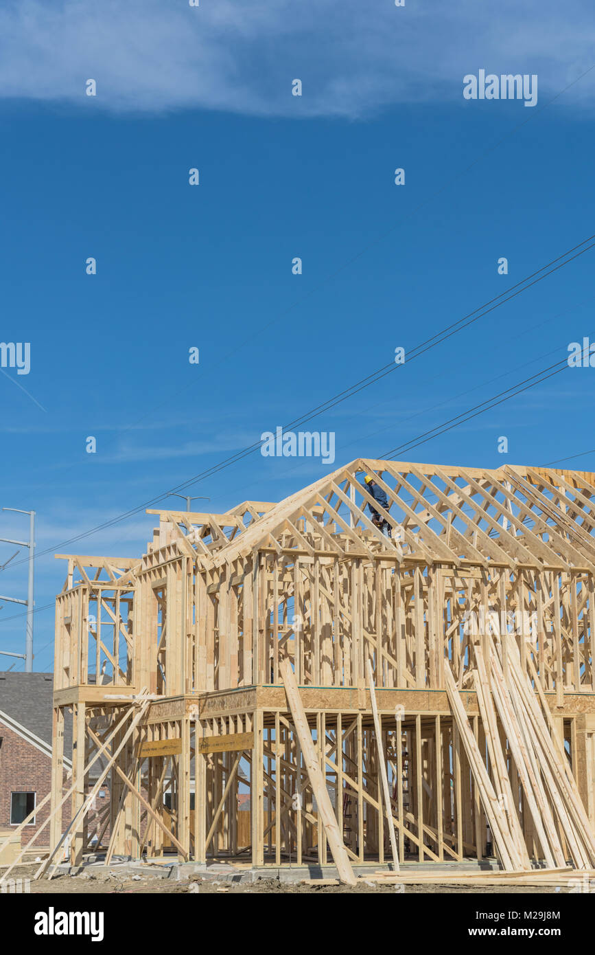 Wood frame house under construction with builder roofing. New two-story ...