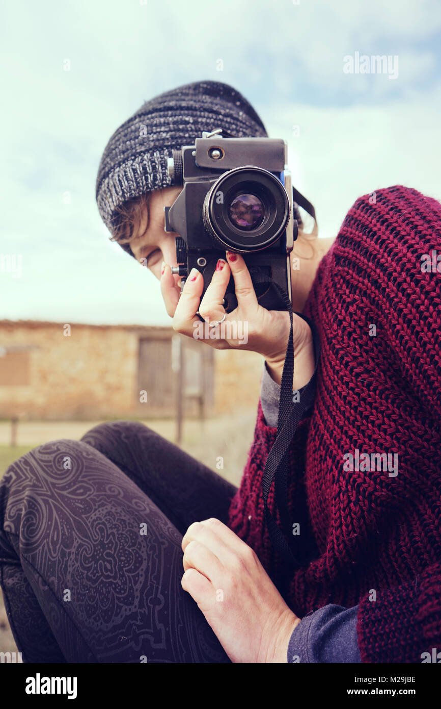 Young woman photographer in a cold day Stock Photo - Alamy