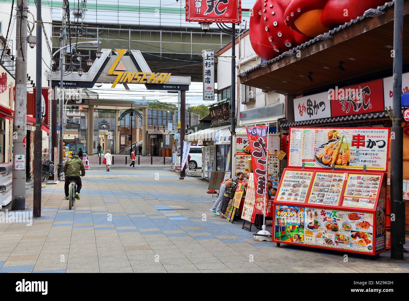 OSAKA, JAPAN - NOVEMBER 23, 2016: People visit Shinsekai neighborhood ...