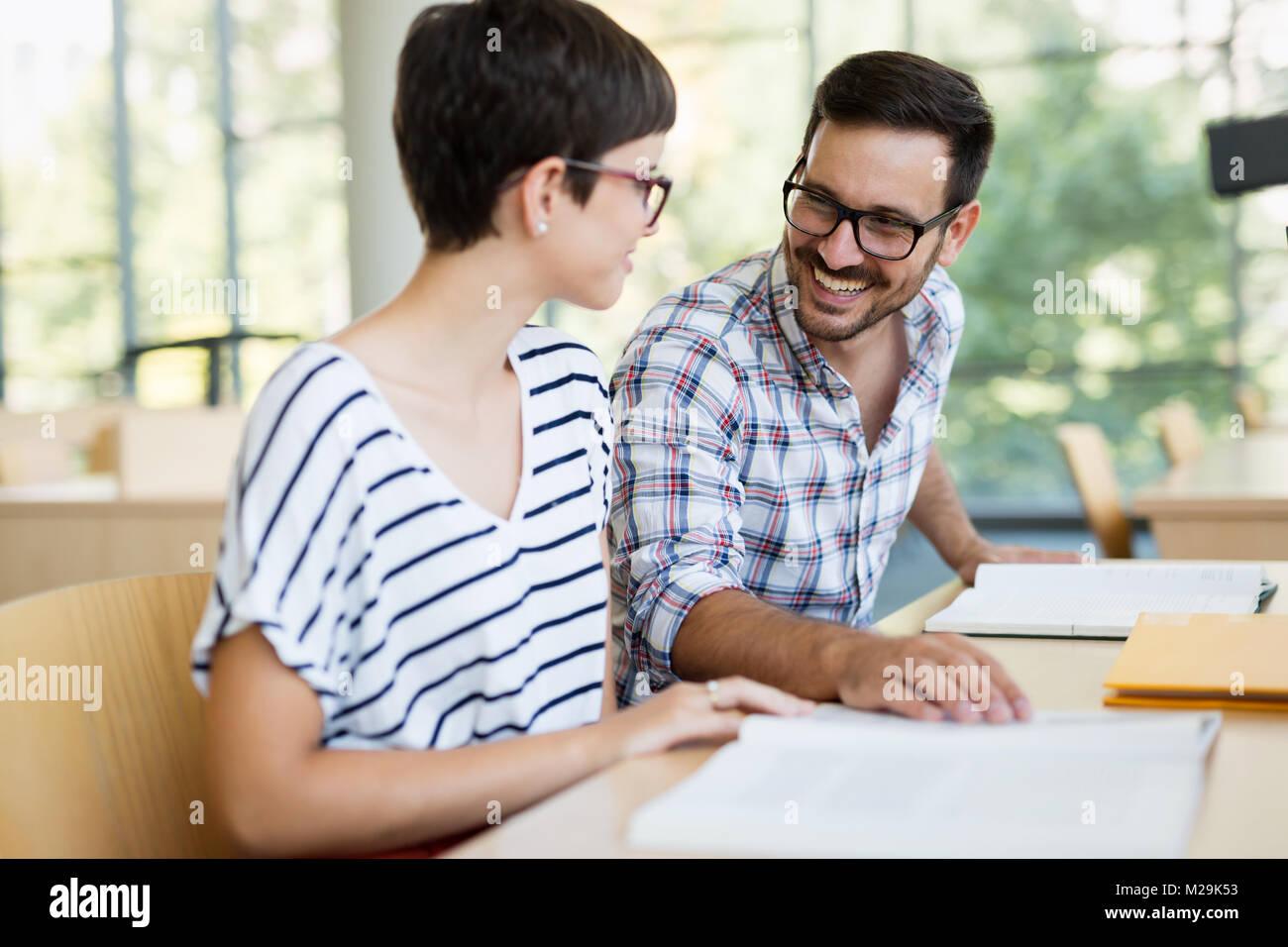 Young woman and man studying for an exam Stock Photo - Alamy