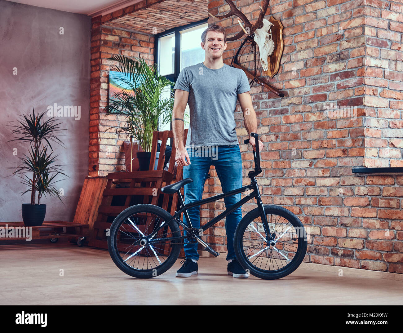 A handsome man with BMX in a studio Stock Photo - Alamy
