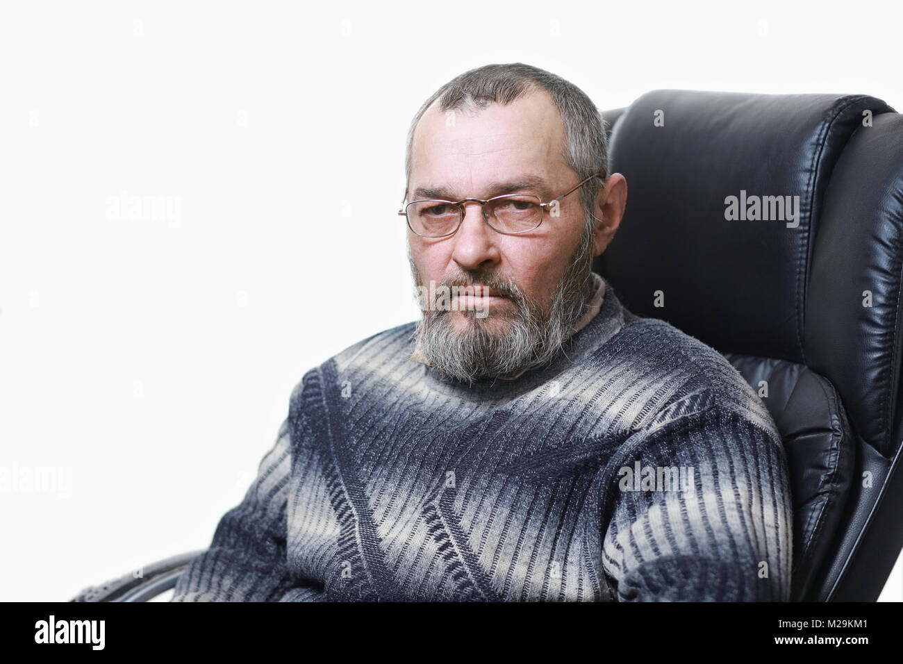 Sad man sitting on a chair hi-res stock photography and images - Alamy