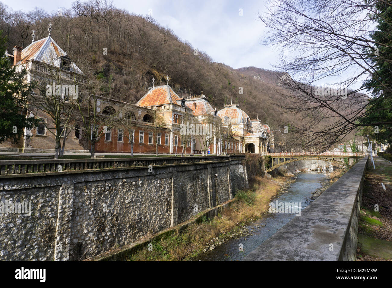 The Cerna river flowing in front of the old imperial mineral and ...