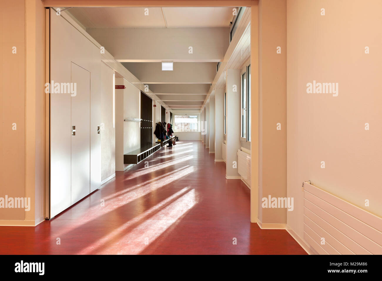 modern public school, corridor red floor Stock Photo - Alamy