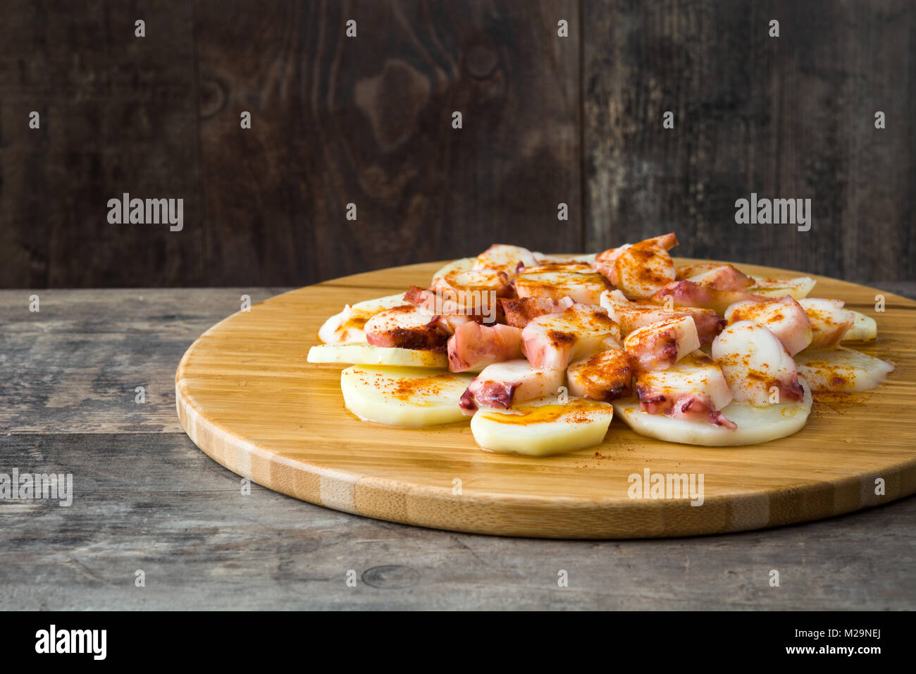 Pulpo a la gallega. Galician octopus on wood. Typical spanish food ...