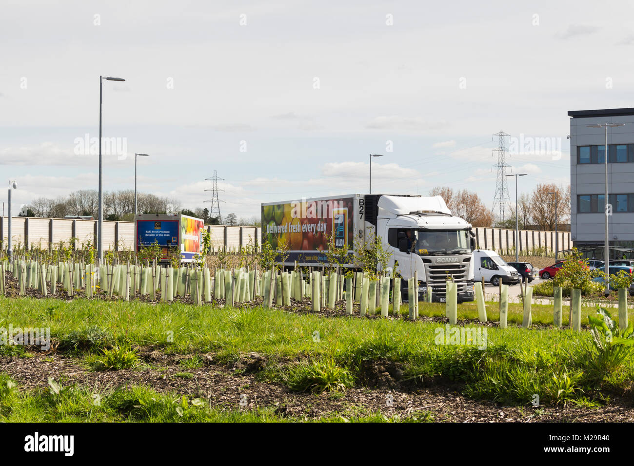 Aldi branded articulated lorries arriving and leaving the new Aldi ...