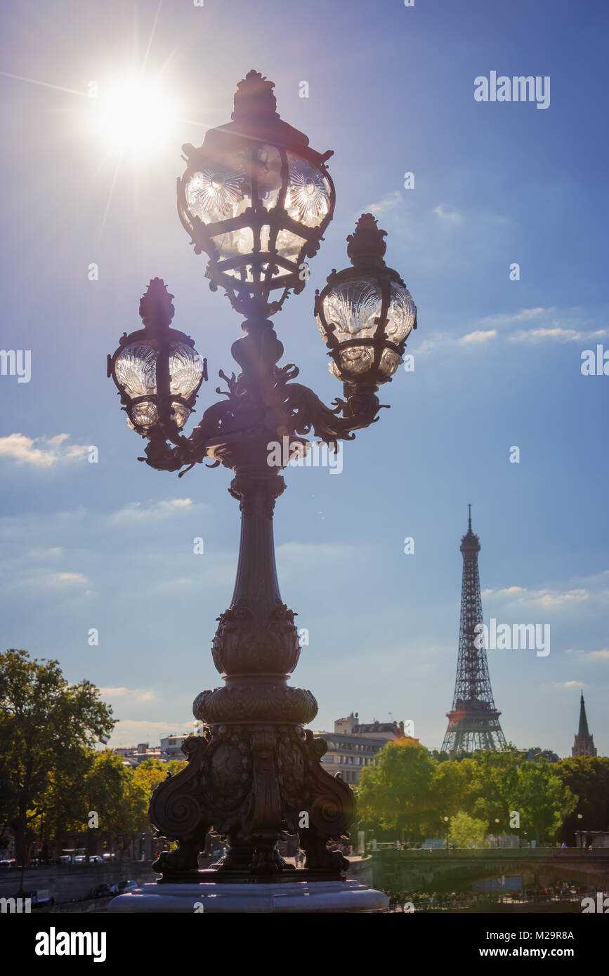 Street lantern on the Alexandre III Bridge against the Eiffel Tower in ...