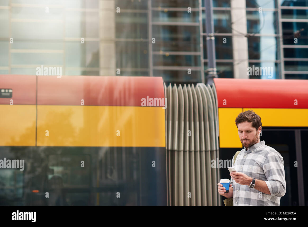 Handsome young man bus stop hi-res stock photography and images - Alamy