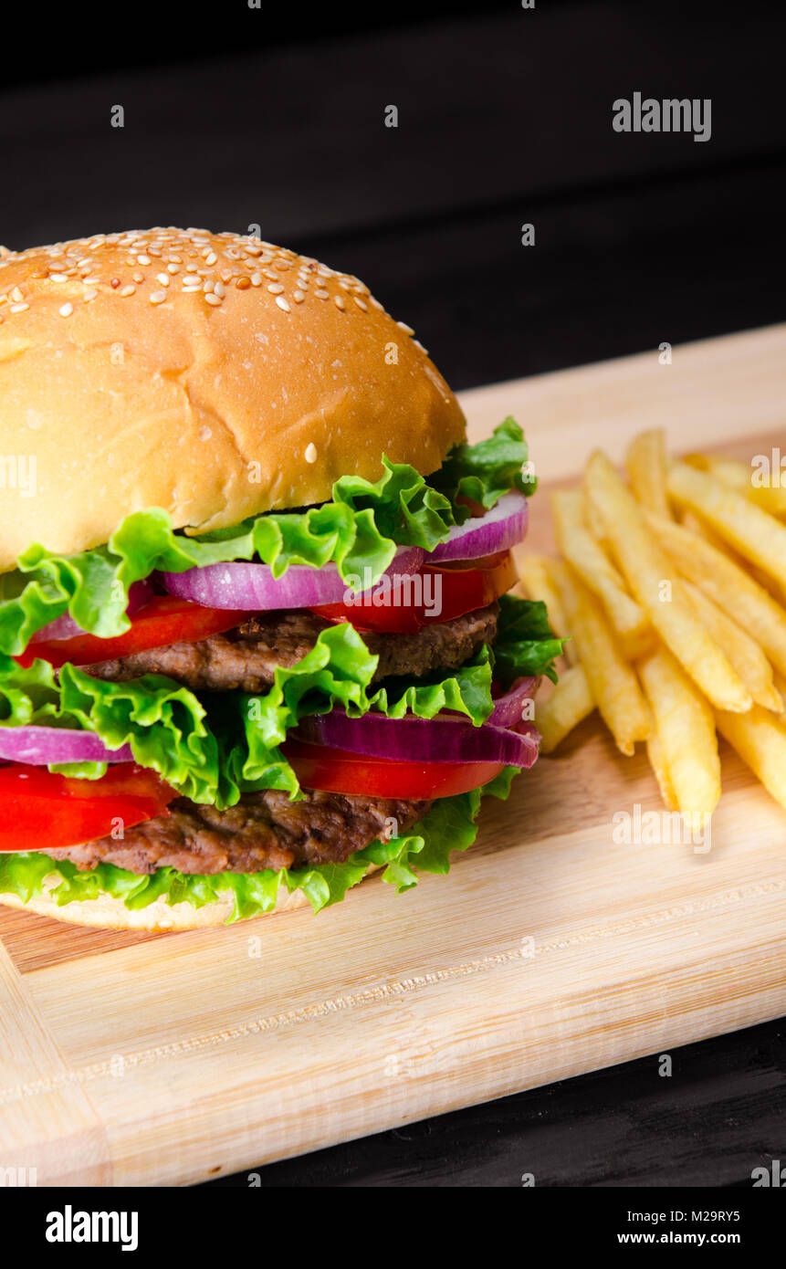Burger served in bun in nutrition fast food concept Stock Photo - Alamy