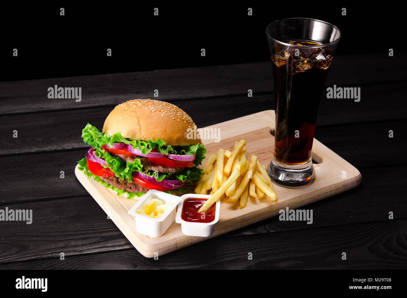 Burger served in bun in nutrition fast food concept Stock Photo - Alamy