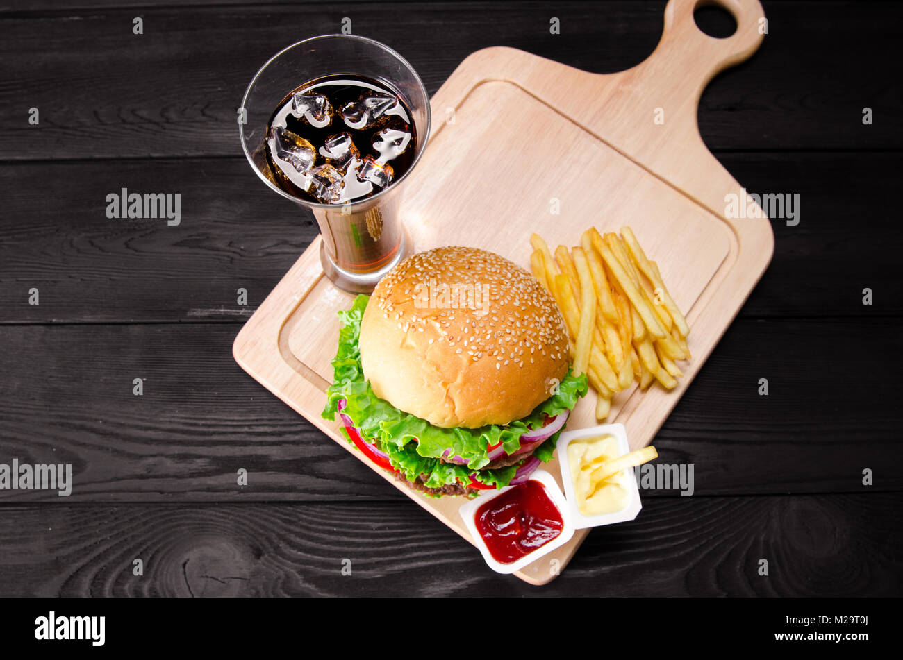 Burger served in bun in nutrition fast food concept Stock Photo - Alamy