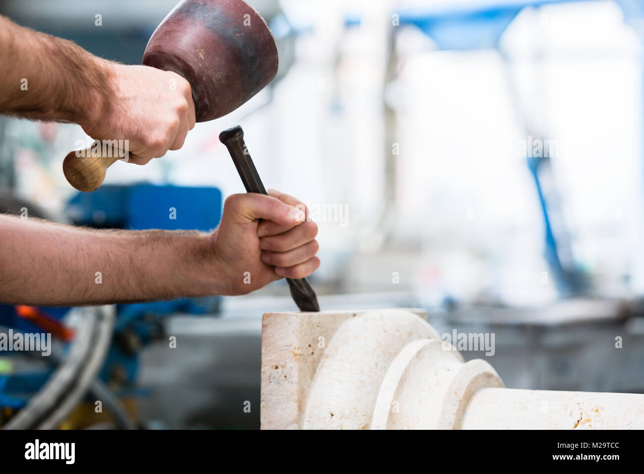 Stone carver working at marble pillar Stock Photo - Alamy