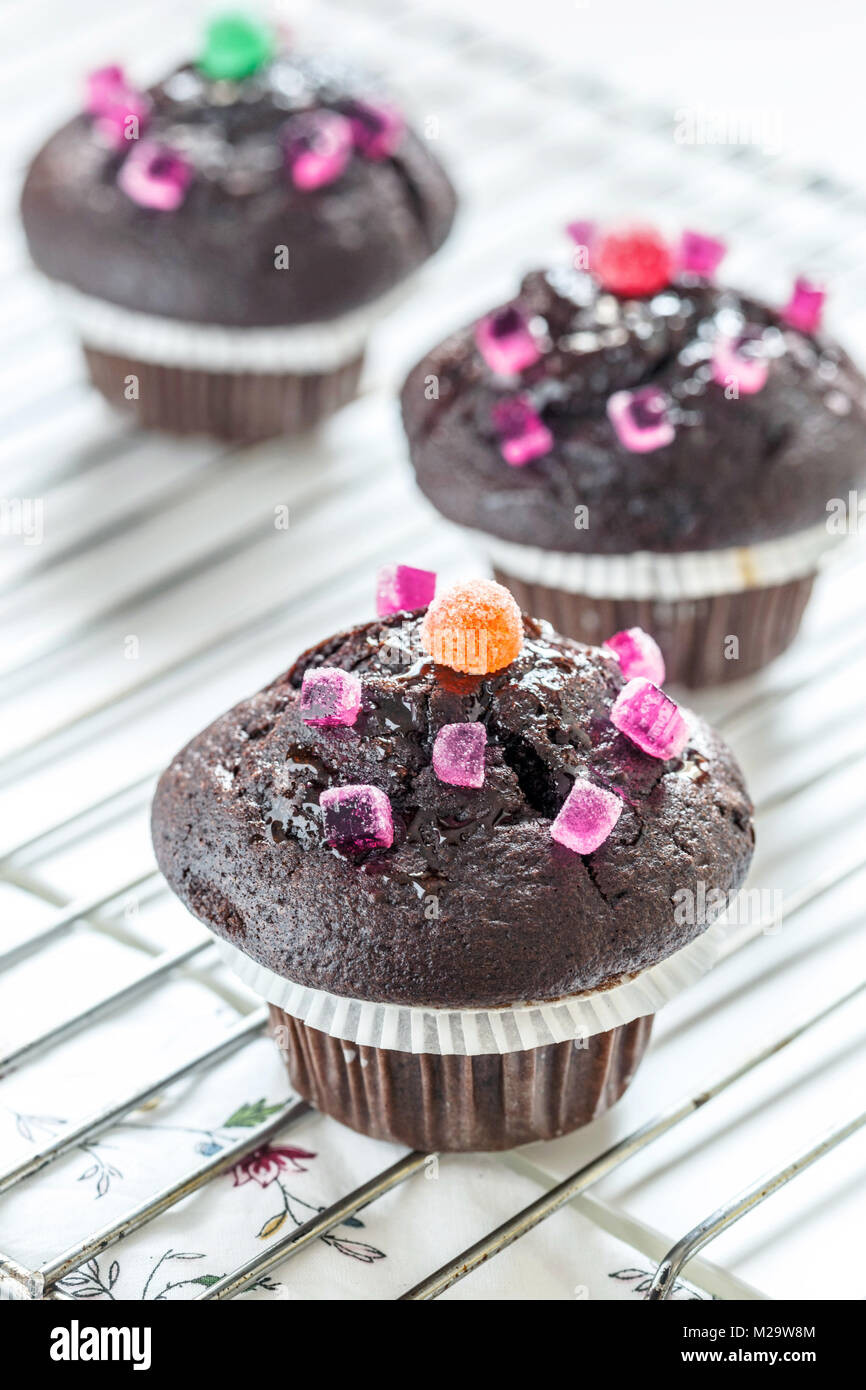 Funny Chocolate Muffins decorated with candies Stock Photo - Alamy