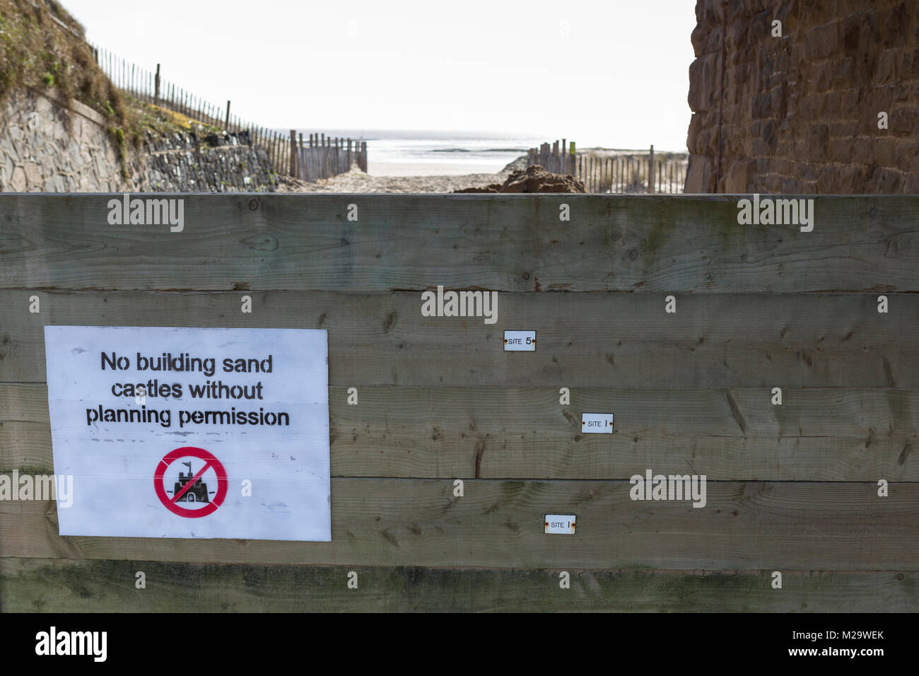 Funny joke sign on beach at Swansea saying No building sand castles ...