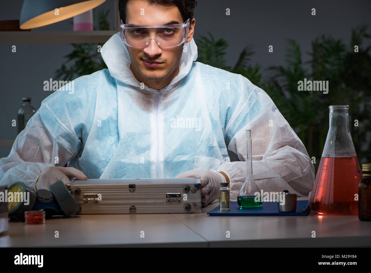 Forensic investigator collecting blood hi-res stock photography and ...