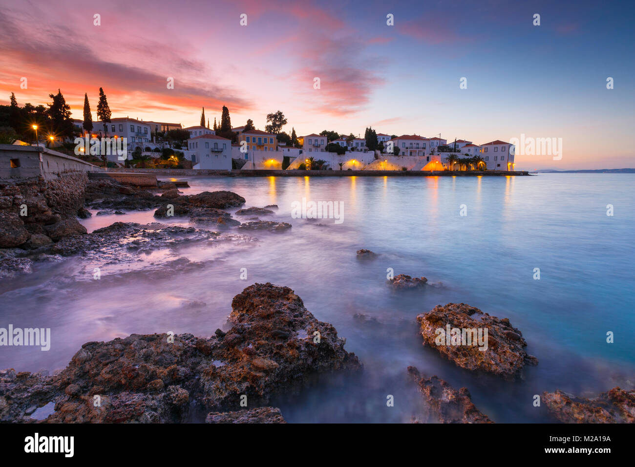 Evening view of Spetses village from the beach, Greece Stock Photo - Alamy
