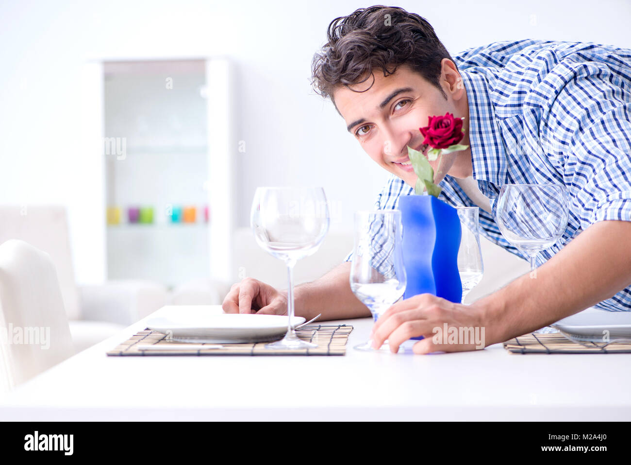 Man alone preparing for romantic date with his sweetheart Stock Photo ...