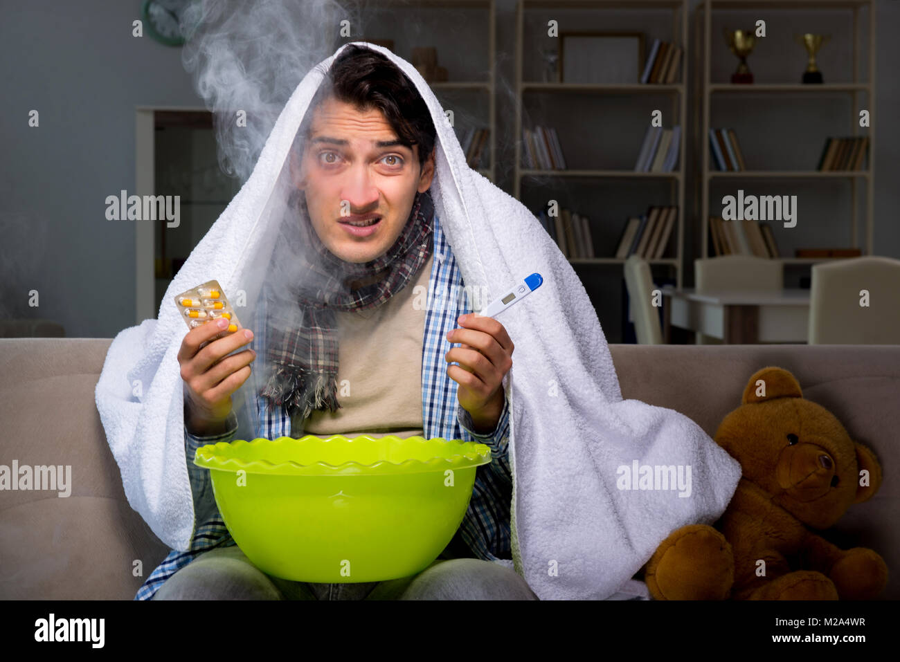 Sick man doing inhalation at night in home Stock Photo - Alamy