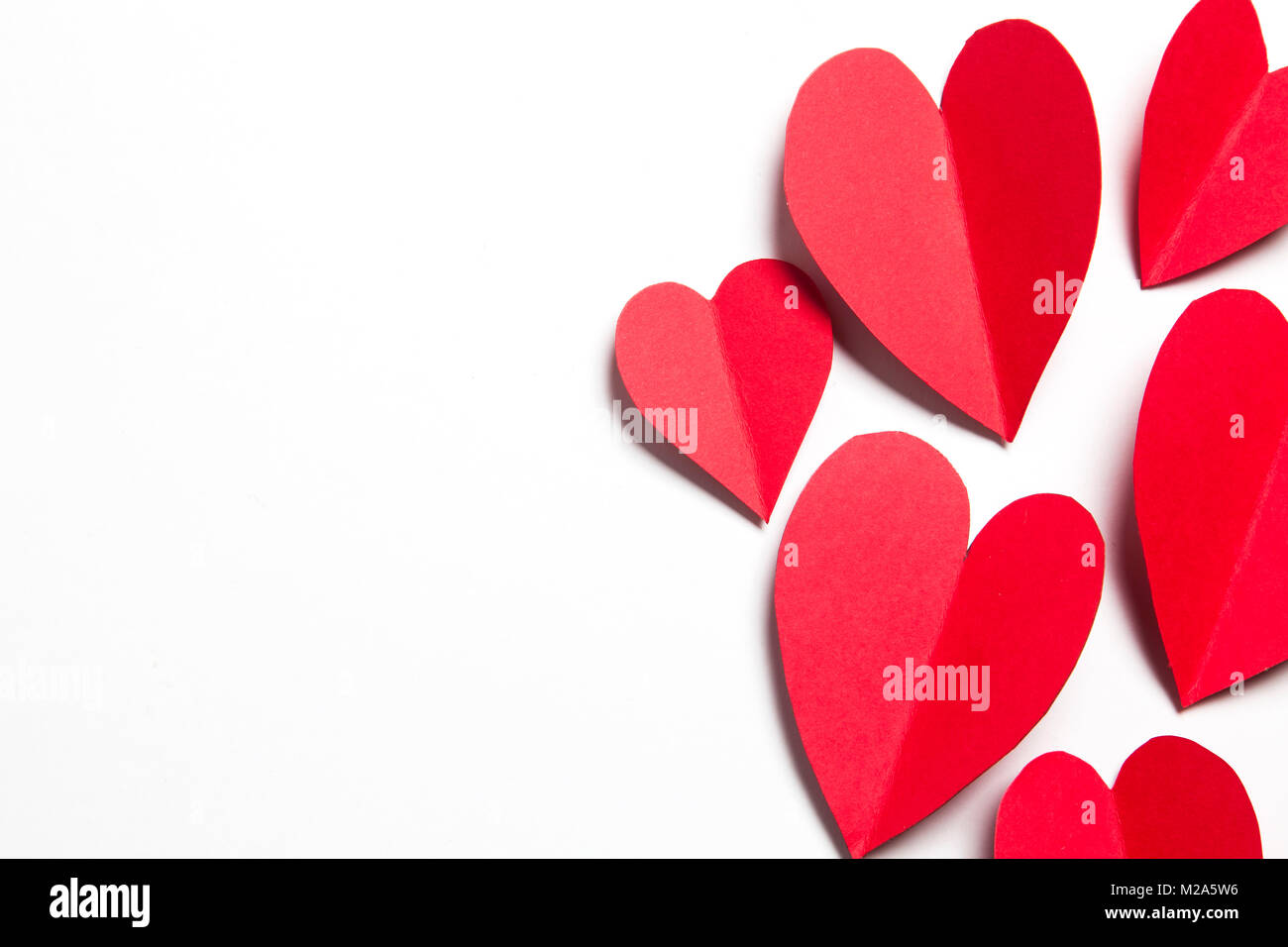 Red handmade paper hearts on a white background Stock Photo - Alamy